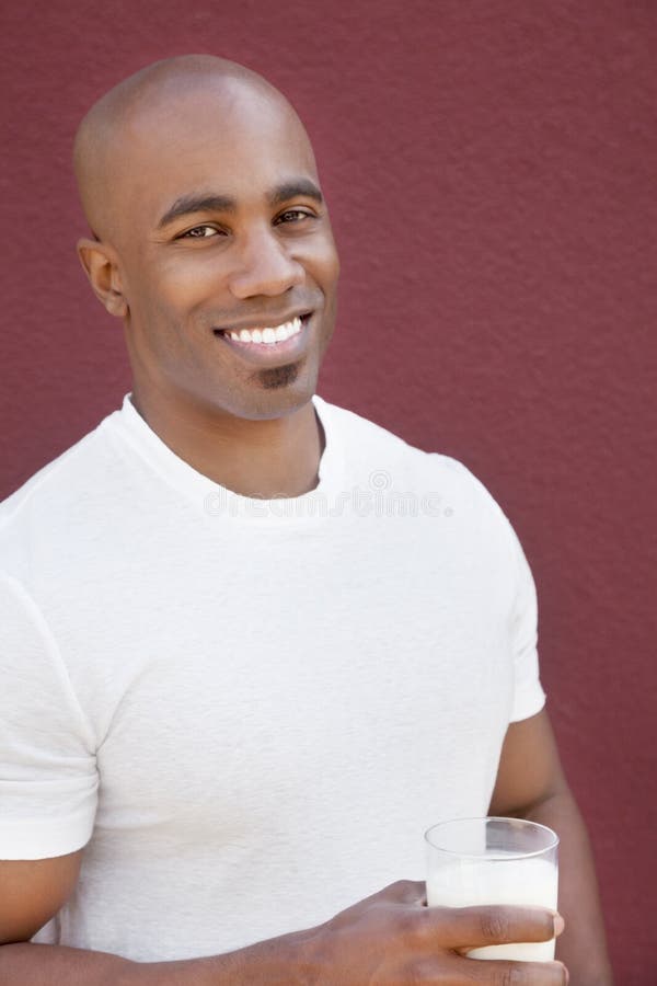 Portrait of a Young Man with Milk Over Colored Background Stock Photo ...