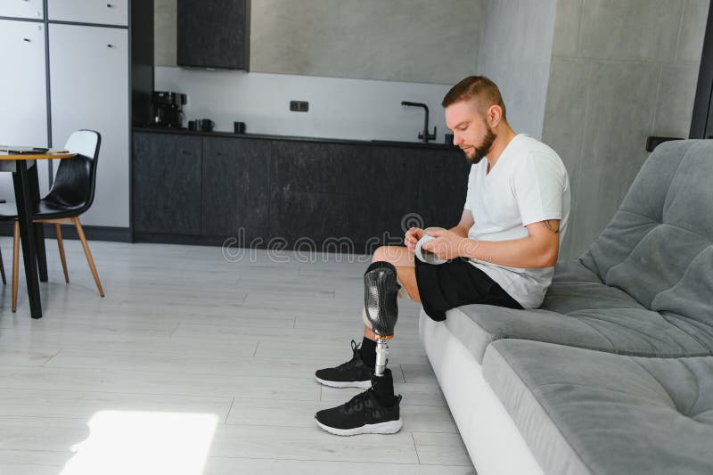 Portrait of a Young Man with a Prosthetic Leg at Home Stock Image ...