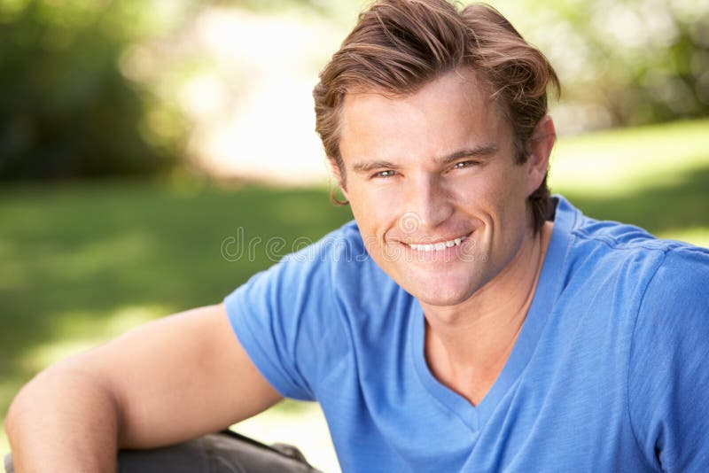 Portrait of Young Man Relaxing in Park Stock Image - Image of outdoors ...