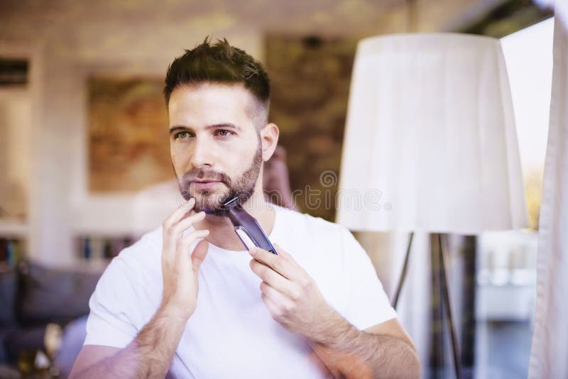 Man Using Electric Razor at Home Stock Image - Image of male, skin ...