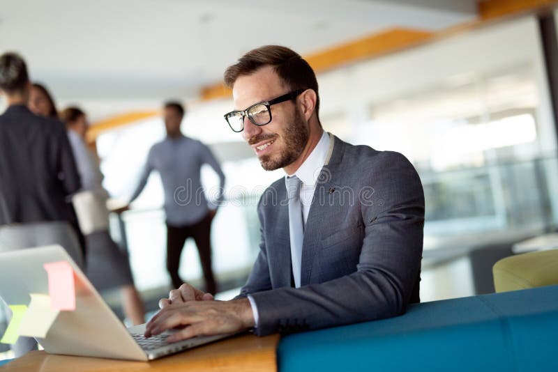 Portrait of Young Man Sitting at Desk in the Office Stock Image - Image ...