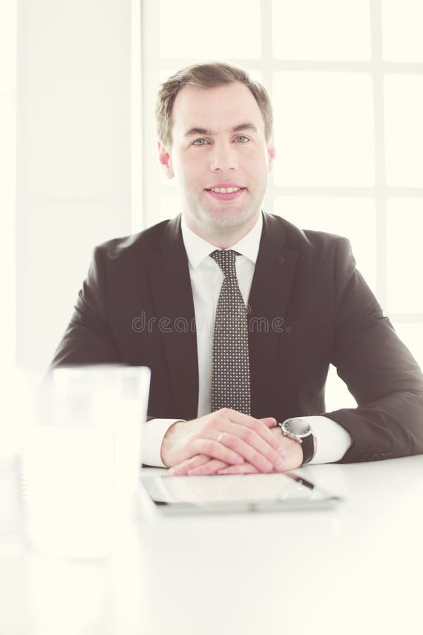 Portrait of Young Man Sitting at His Desk in the Office. Stock Image ...