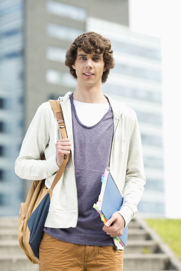 Portrait of Young Man Standing at College Campus Stock Image - Image of ...