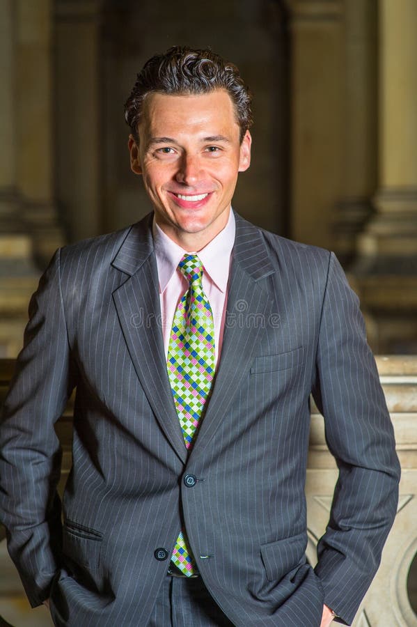 Portrait of Young Man Standing Inside Office Building, Looking Forward ...