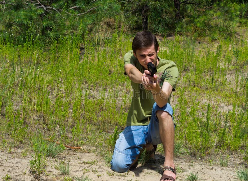 Portrait of a Young Man Taking Aim with a Pneumatic Gun Stock Image ...