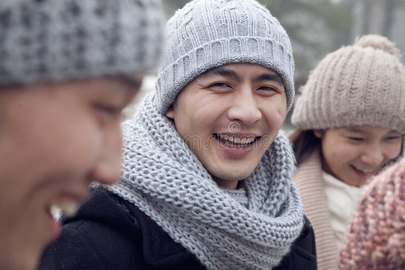 Portrait of Young Man in Winter with Friends, Smiling Stock Image ...