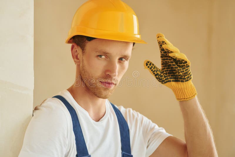 Portrait of Young Man Working in Uniform at Construction at Daytime ...