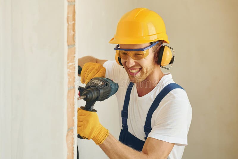 Portrait of Young Man Working in Uniform at Construction at Daytime ...
