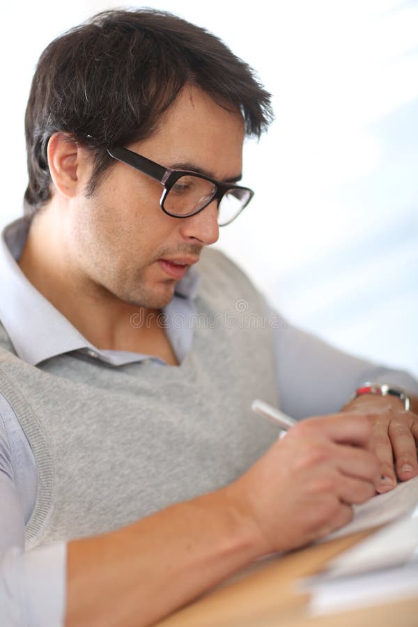Portrait of Young Man Writing Notes Stock Photo - Image of writing ...
