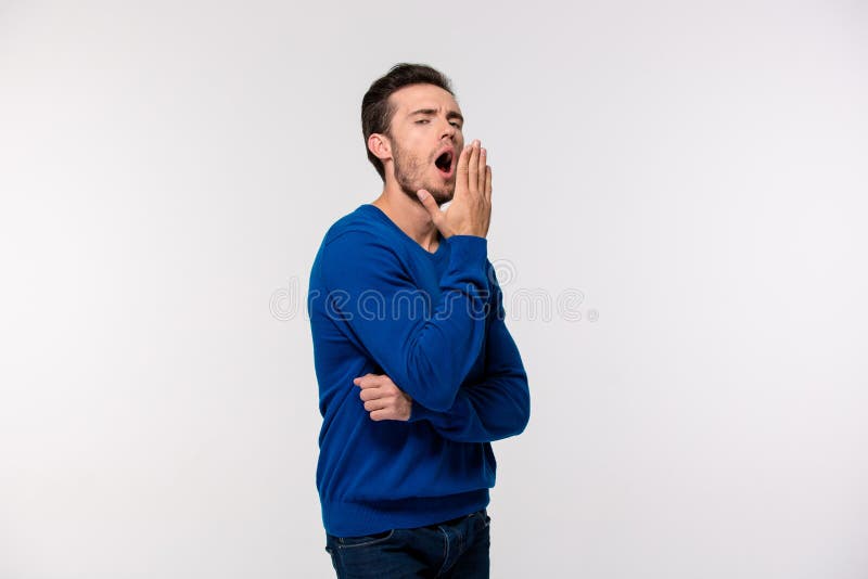Portrait of a Young Man Yawning Stock Photo - Image of handsome, blue ...