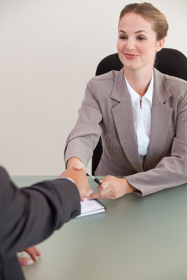 Portrait of a Young Manager Shaking the Hand of a Customer Stock Image ...