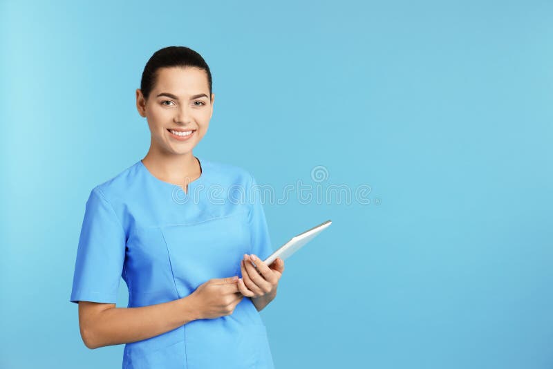 Medical Assistant Holding Glassware with Liquid Near Microscope in ...