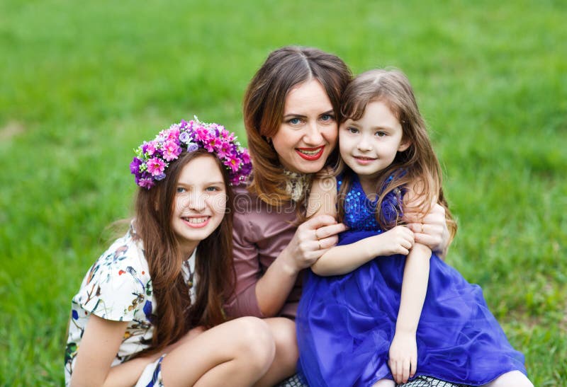 Portrait of a Young Mother and Her Two Daughters Stock Image - Image of ...