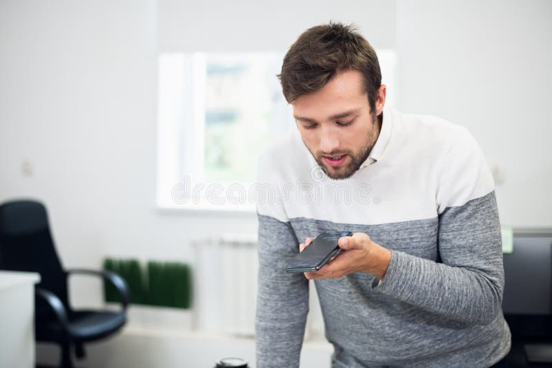 A Portrait of a Young Office Worker Talking To Someone Over the Phone ...