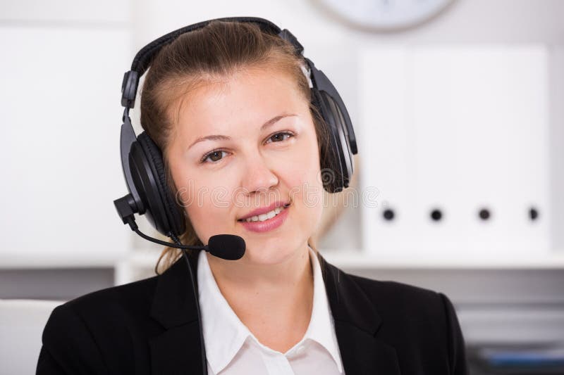 Portrait of Young Operator Female in Black Suit Which is Talking by ...