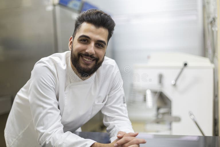 Young Pastry Chef Looking at Camera Smiling Stock Photo - Image of ...