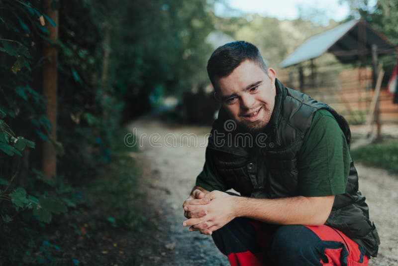 Portrait of Young Pensive Man with Down Syndrome, Resting after ... Portrait of Young Pensive Man with Down Syndrome, Resting after ...