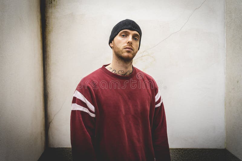 Portrait of Young Rapper Posing in Front of a White Wall Stock Photo ...