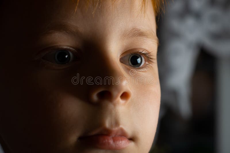 Portrait of a Young Red-haired Boy in a Dark Room Close-up Stock Image ...