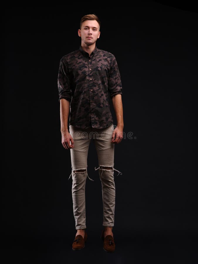 Portrait of a Young Serious Man Posing on a Black Background Stock ... Portrait of a Young Serious Man Posing on a Black Background Stock ...