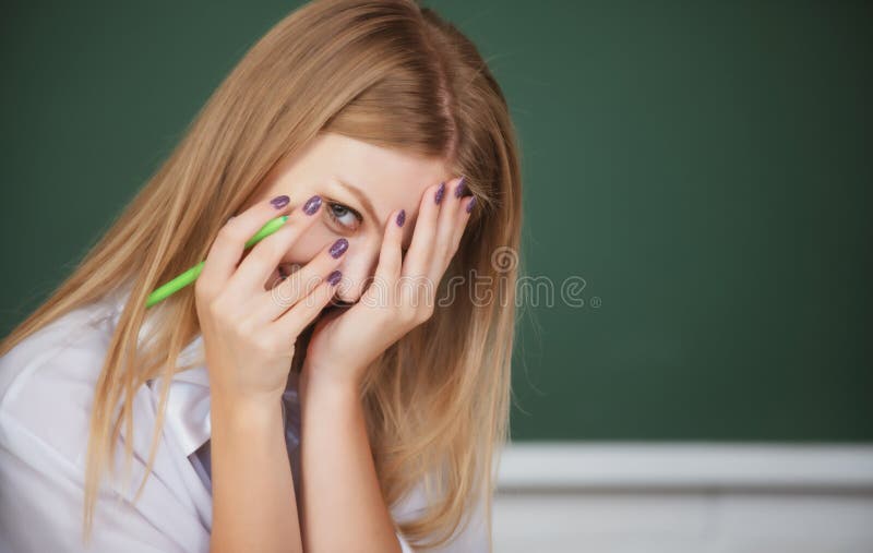 Portrait of a Young Shame Embarrassed Female Student Studying in School ...