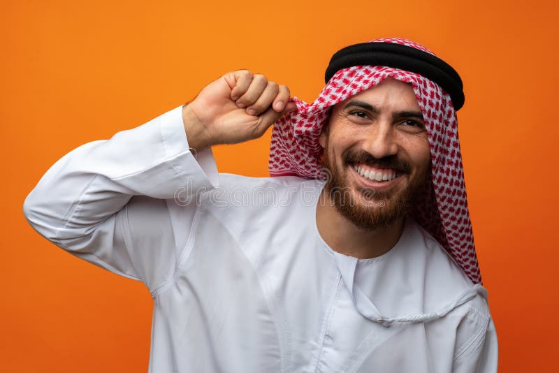 Portrait of Young Smiling Arab Man on Orange Background Stock Image ...
