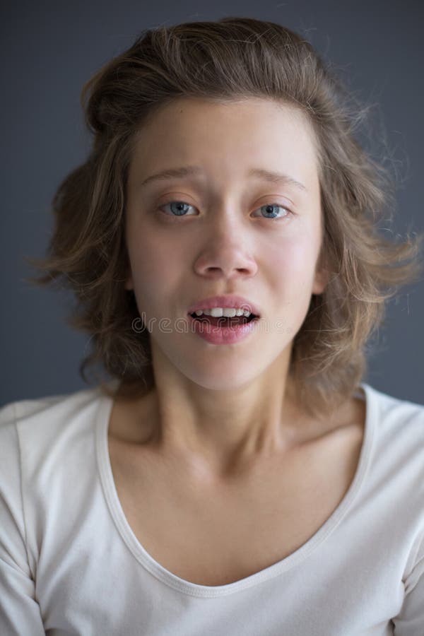 Portrait of Young Startled Lady Sadly Looking in Camera Stock Image ...