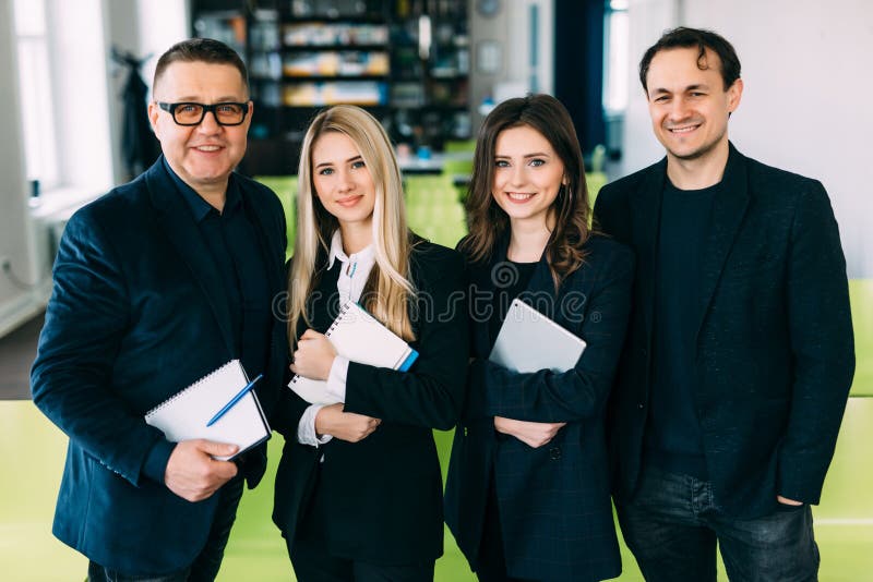 Portrait of Young Successful Creative Business Team Looking at Camera ...