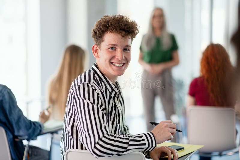 Portrait of Young University Student Sitting in Classroom Indoors ...