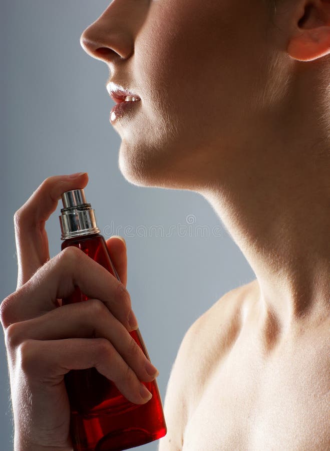 Portrait Of A Young Woman Adding Spray To Her Face Stock Image - Image ...