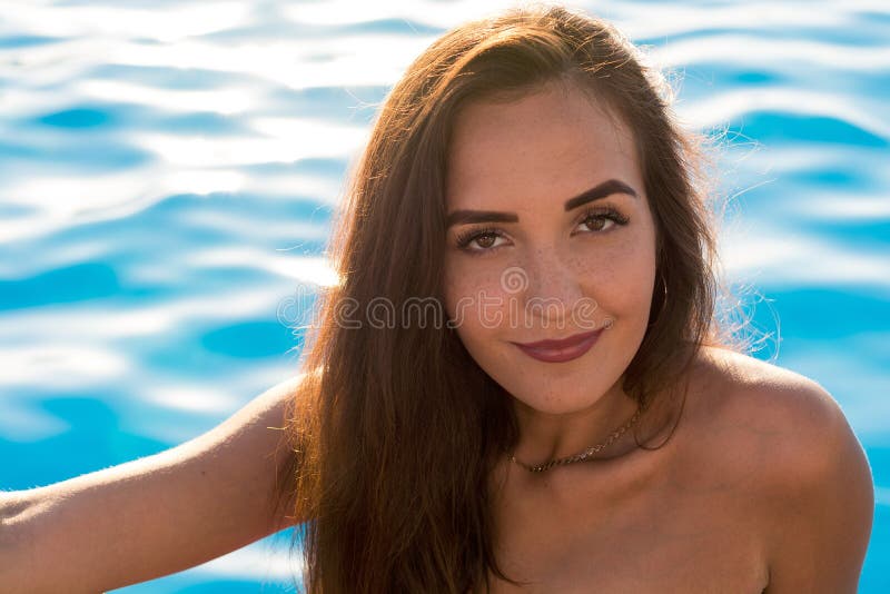 Beautiful Young Brunette Woman With Long Hair In Pink Bikini Sit Stock