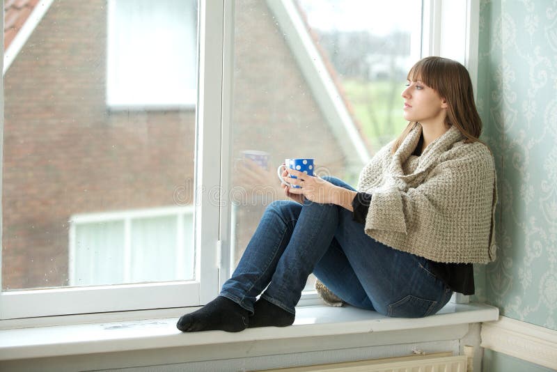 Young Woman Looking Out Window Stock Photography - Image: 29814162