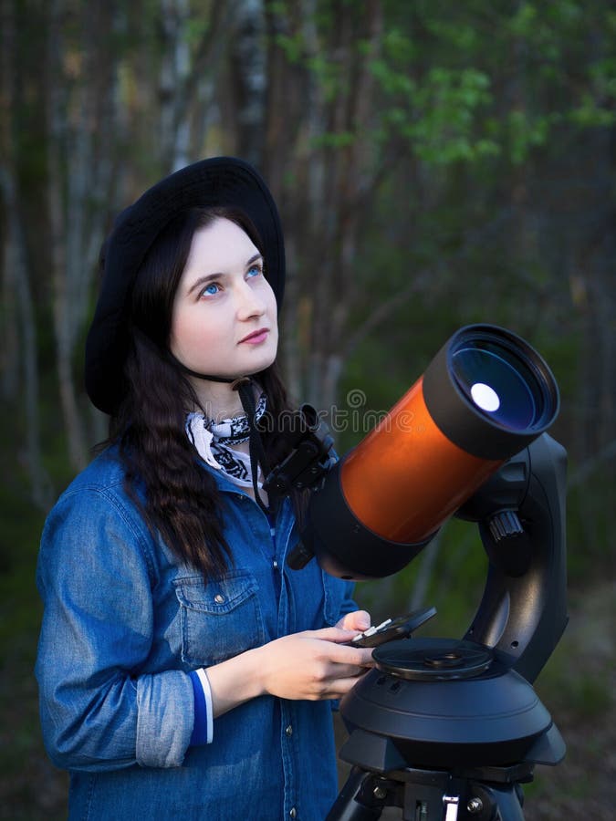Portrait of Young Woman Looking through the Telescope on the Hil Stock ...