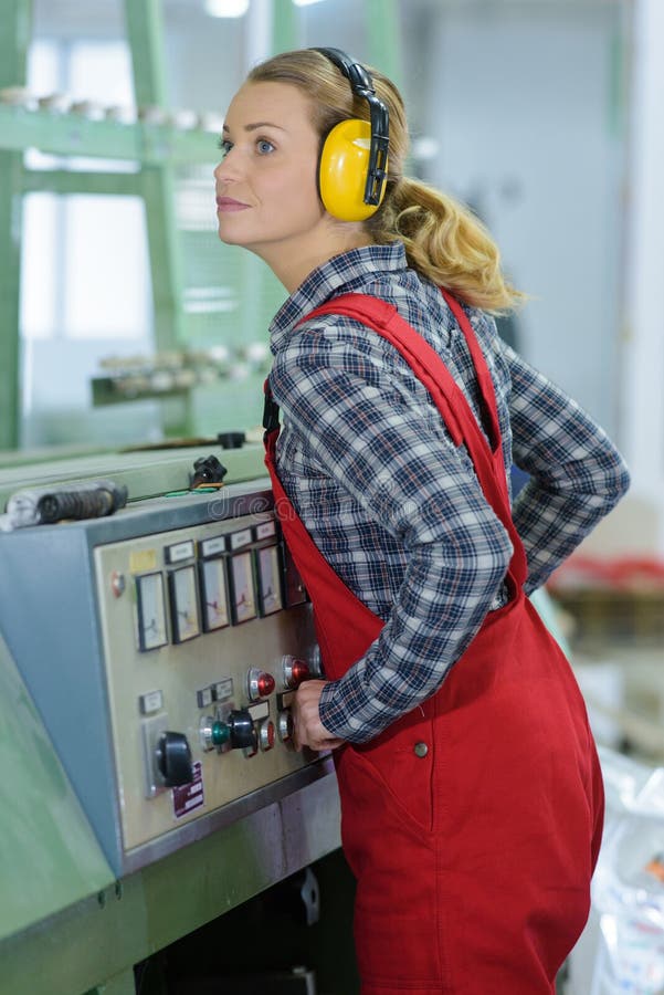 Woman Operating Drilling Machine Concentrating on Job Stock Photo ...