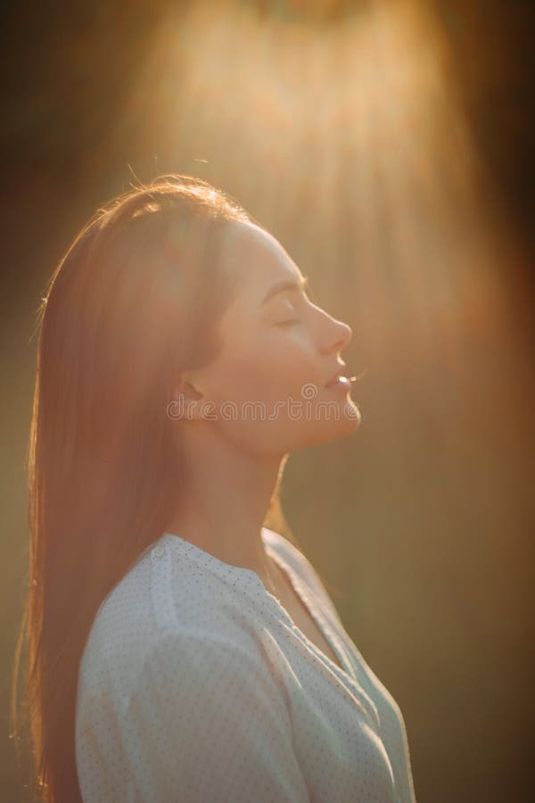 Portrait of Young Woman Under Sun Rays Stock Photo - Image of happy ...