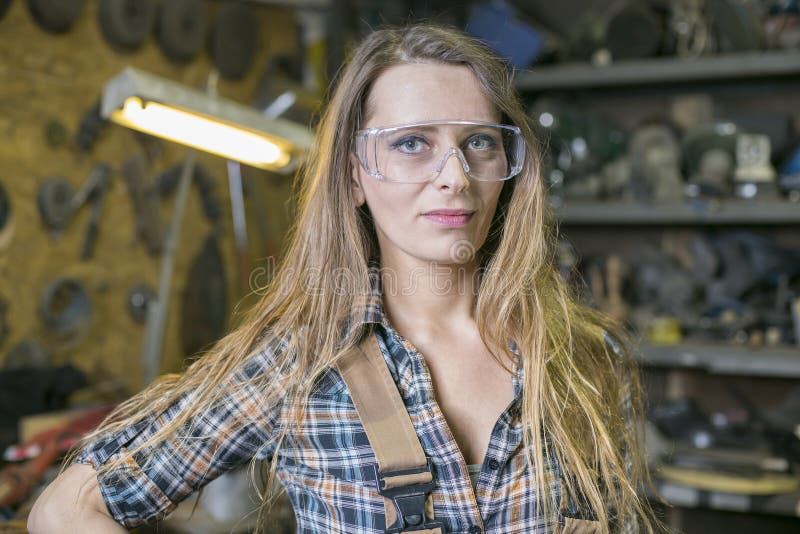 Portrait of a Young Woman in a Workshop Stock Image - Image of ...