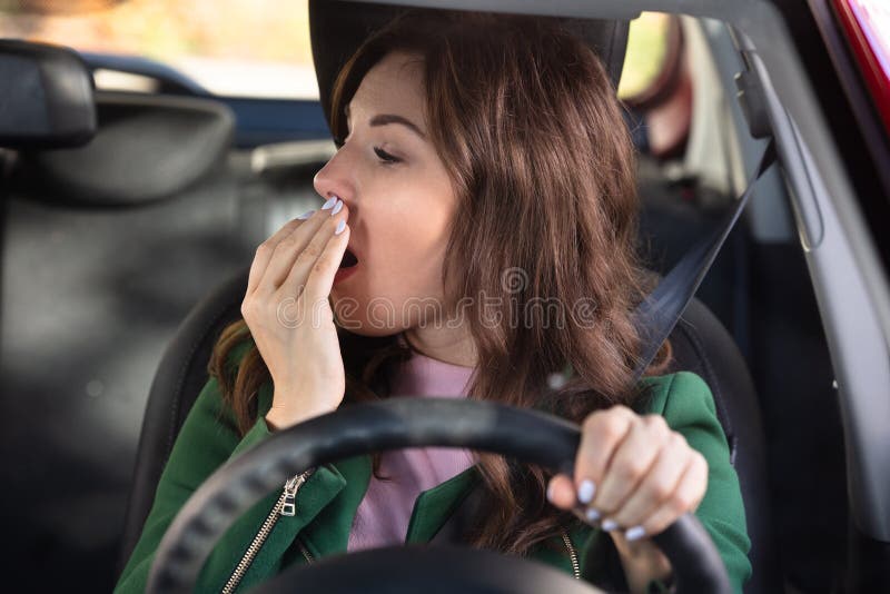 Woman Yawning Inside Car stock image. Image of open - 149407455