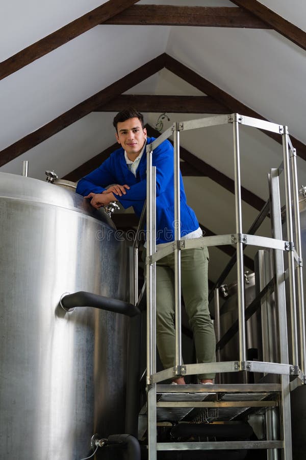 Portrait of Young Worker Standing by Storage Tank Stock Image - Image ...