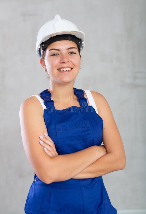 Young Woman Posing in Work Overalls in Studio Stock Photo - Image of ...