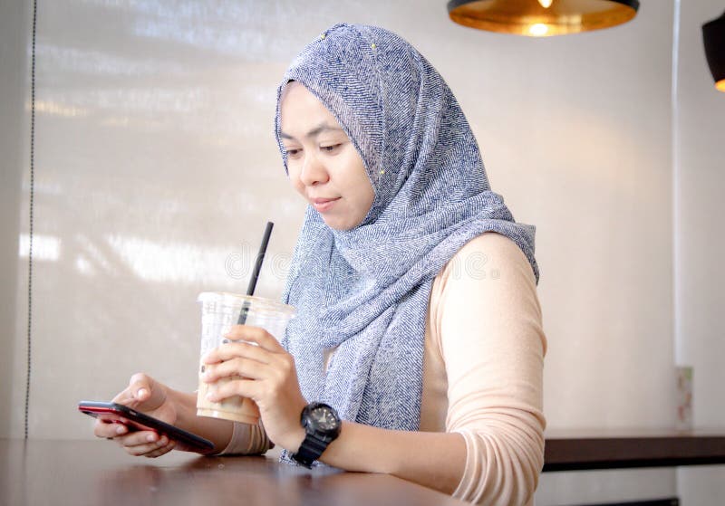 Portraits of Muslim Women. Muslim Woman Using Mobile Phone for Business ... Portraits of Muslim Women. Muslim Woman Using Mobile Phone for Business ...