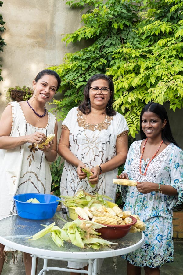 Portraits of Women Shelling Corn Stock Image - Image of girl, face ...