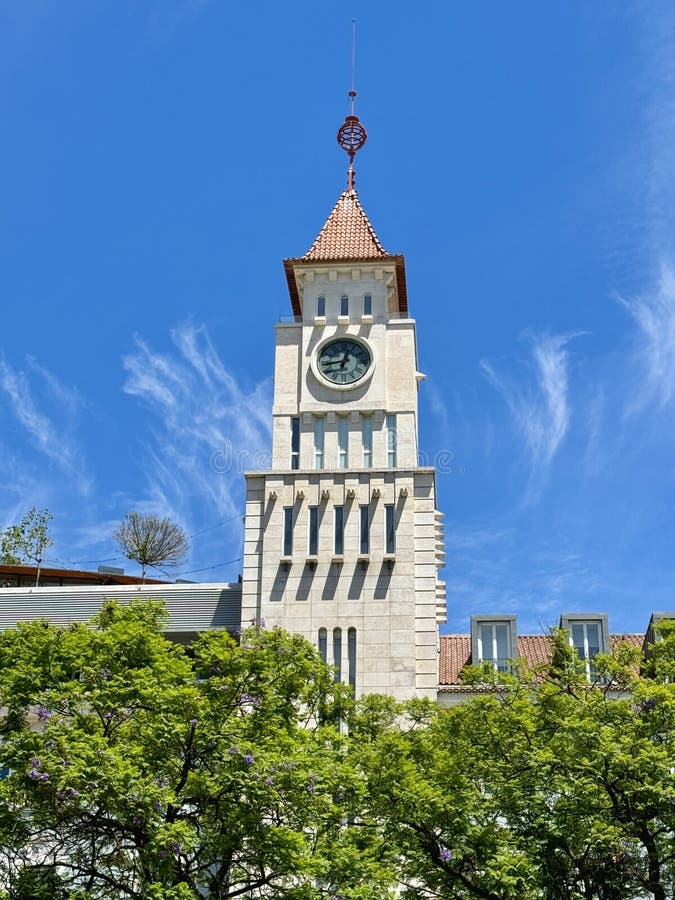 A Beautiful Clock Tower Against the Blue Sky in Lisbon, Portugal Stock ...