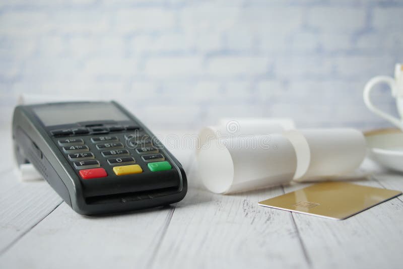 POS Machine and Long Roll Paper on Blue . Stock Image - Image of ...
