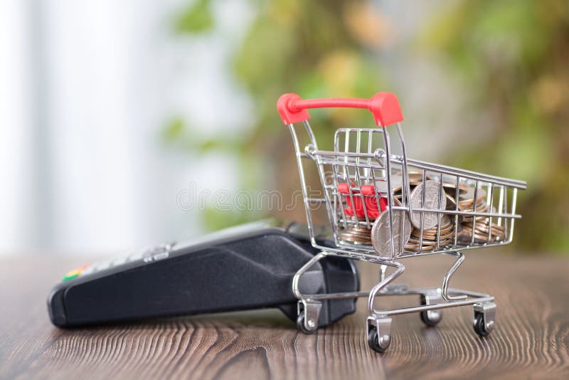 POS Machine and Shopping Cart Full of Coins Stock Image - Image of ...