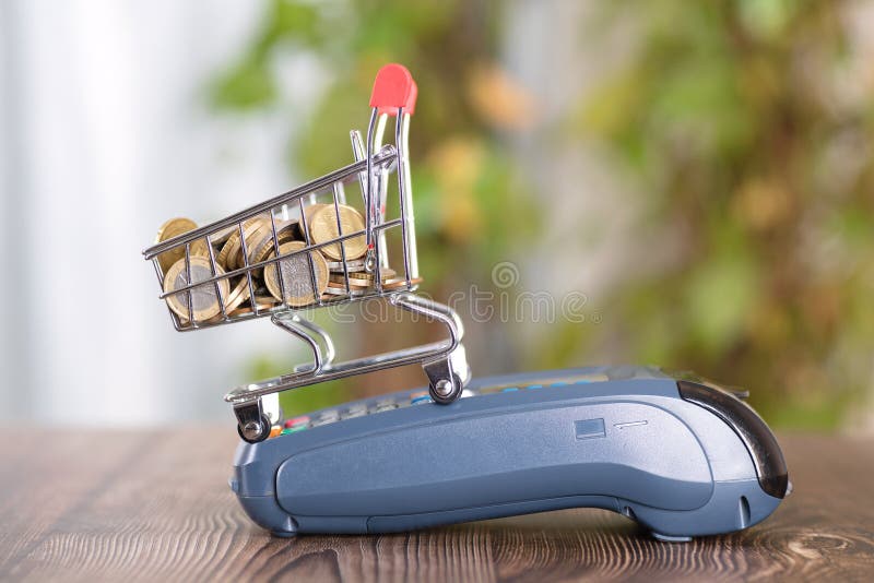 POS Machine and Shopping Cart Full of Coins Stock Image - Image of ...