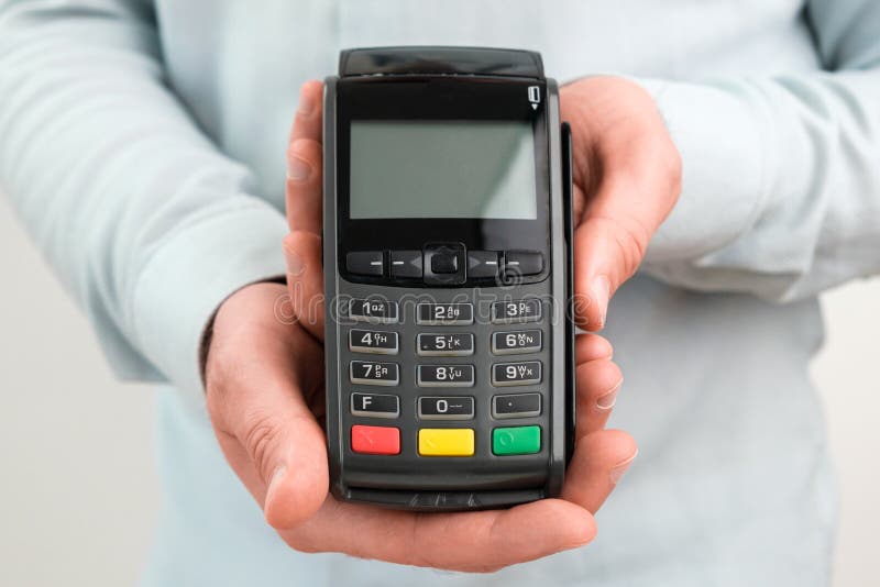 POS Terminal or Credit Card Reader Machine on the White Table with Copy ...