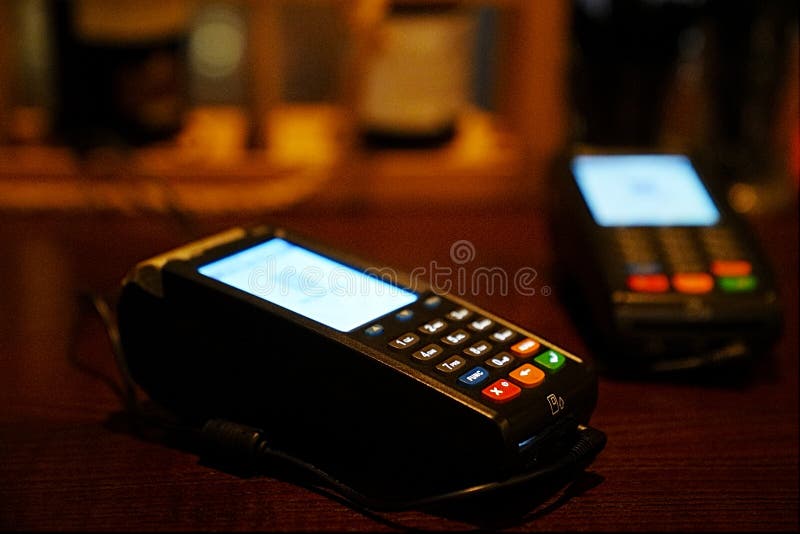 A POS Terminal on a Table in a Dark Room. Stock Image - Image of ...