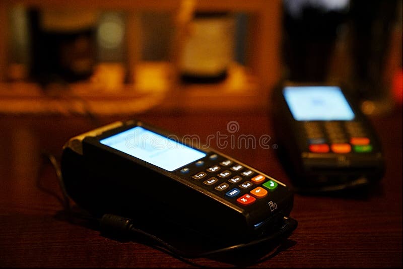 A POS Terminal on a Table in a Dark Room. Stock Image - Image of ...