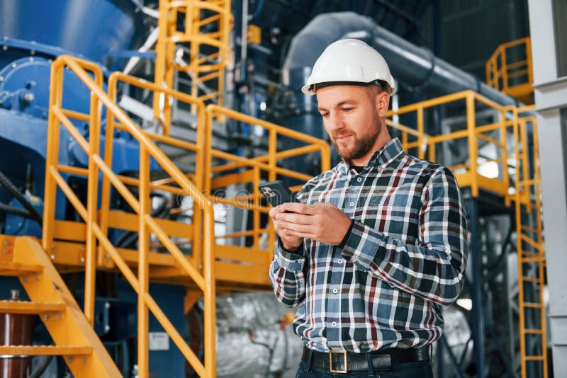 Posing for Camera. Construction Worker in Uniform is in the Factory ...