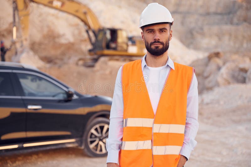 Posing for a Camera. Man in Uniform is Working in the Quarry at Daytime ...